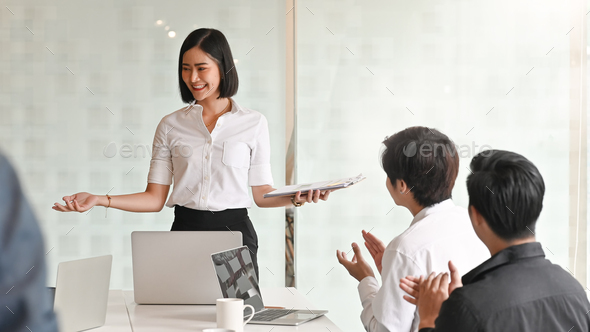 Encouragement from workmate in the meeting room with present idea ...