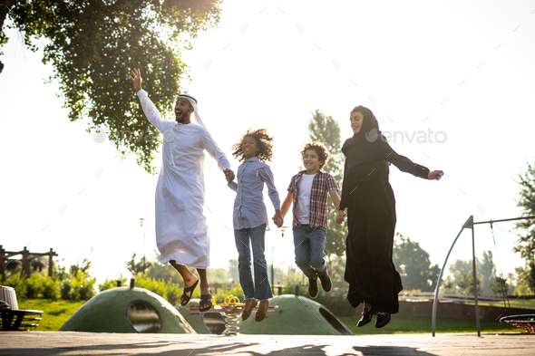 Cinematic image of a family playing at the playground Stock Photo by ...