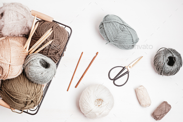 Craft hobby background with yarn in natural colors Stock Photo by OksaLy
