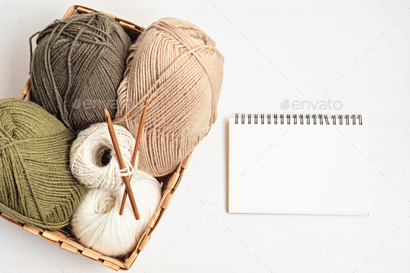 Craft hobby background with yarn in natural colors Stock Photo by OksaLy