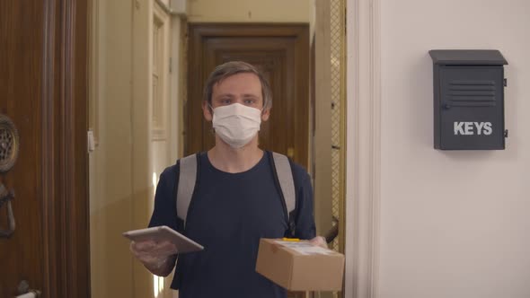 Postman or Delivery Man Carry Small Box Deliver to Customer at Home ...