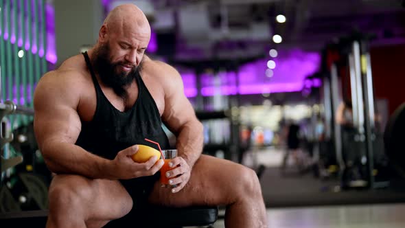 Professional Sportsman is Drinking Grapefruit Juice in Gym After ...