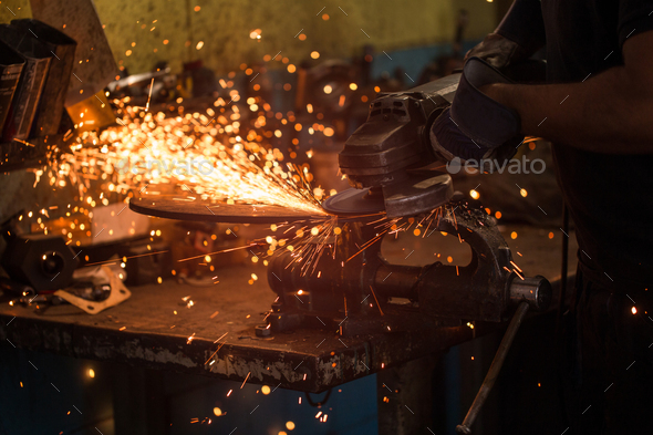 worker using an angle grinder Stock Photo by ADDICTIVE_STOCK | PhotoDune