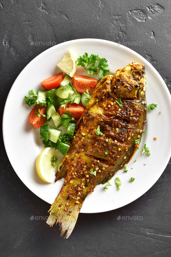 Roasted fish on plate Stock Photo by voltan1 | PhotoDune