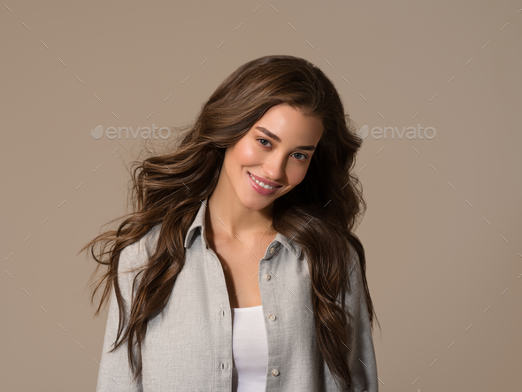 Beautiful woman with long hair happy smile. Color background. Brown ...