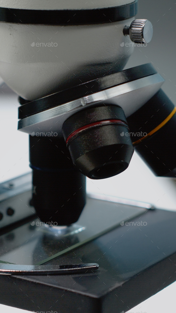 Close up of microscopic magnifying glass and lens Stock Photo by DC_Studio