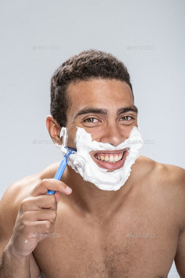 Cheerful male being happy changing his appearance Stock Photo by Iakobchuk