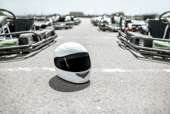 Protective helmet on the go-kart track Stock Photo by RossHelen | PhotoDune