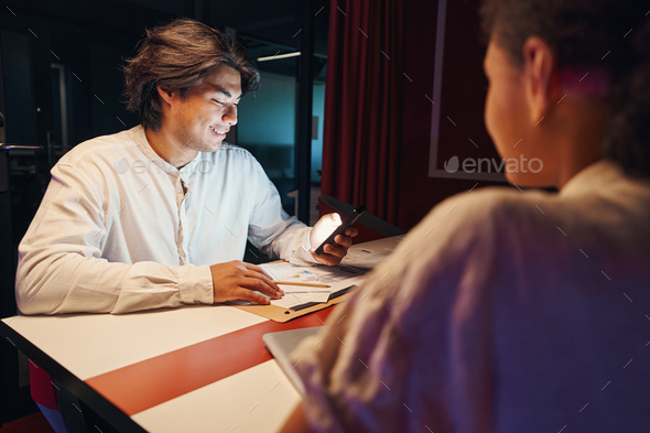 Female person preparing documents for presentation together Stock Photo ...