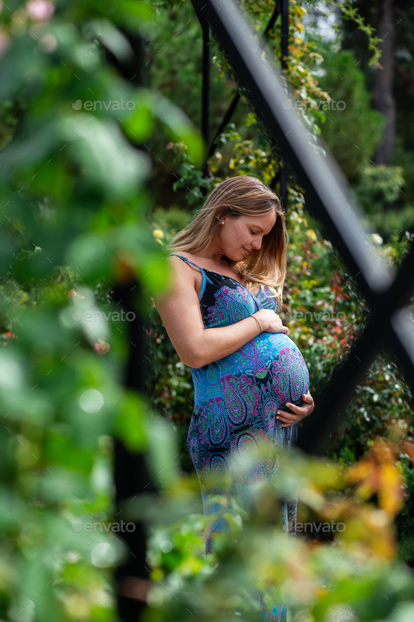 Pregnant woman holding belly Stock Photo by ADDICTIVE_STOCK | PhotoDune