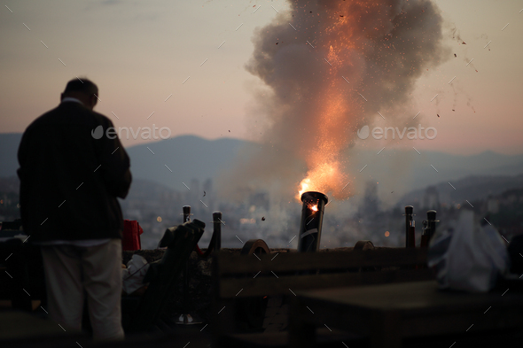 Man throws gun fireball to start a celebration Stock Photo by Pasanheco