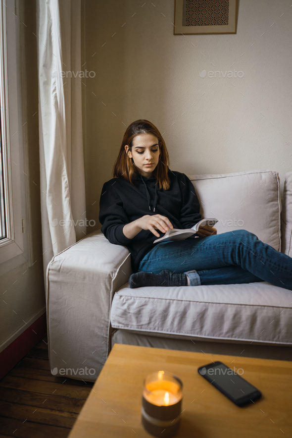 Woman relaxing with book at home Stock Photo by ADDICTIVE_STOCK | PhotoDune