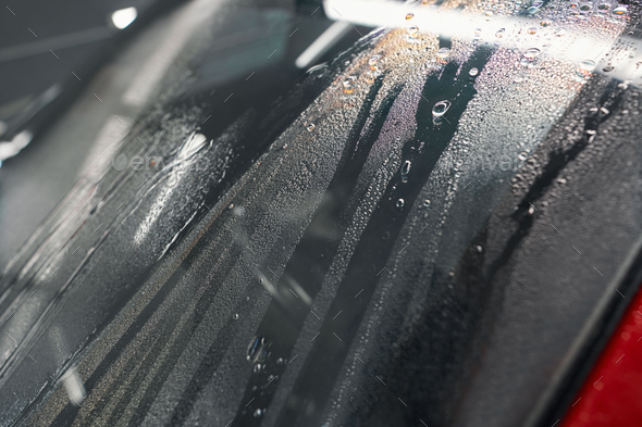 Photo of car hood after cleaning by high pressure washer Stock Photo by ...