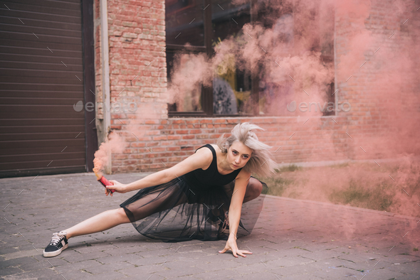 beautiful young female dancer in pink smoke on street Stock Photo by ...