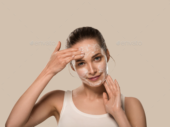Soap face woman clean skin beauty. Color background. Brown Stock Photo ...