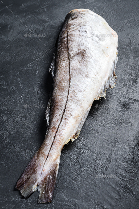 Fresh haddock fish carcass. Black background. Top view Stock Photo by ...