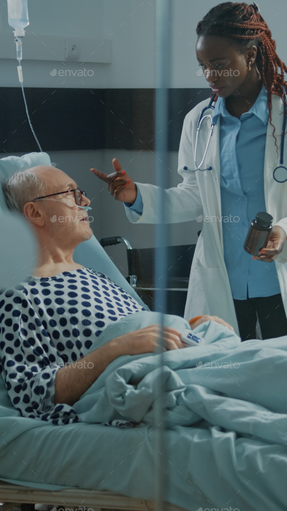 Sick patient laying in hospital ward bed at facility Stock Photo by DC ...