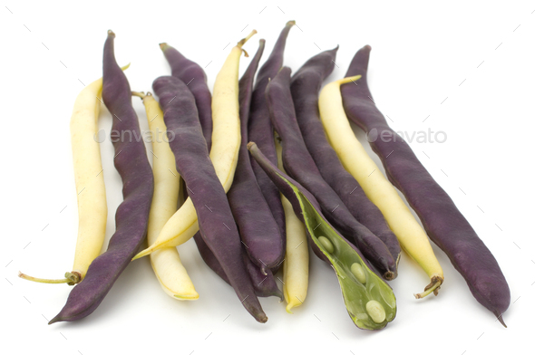 Pile of purple string beans isolated on white Stock Photo by emartsstudio