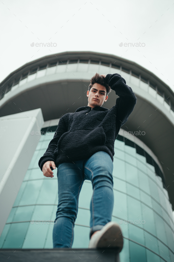 from below Young man stepping down Stock Photo by ADDICTIVE_STOCK ...