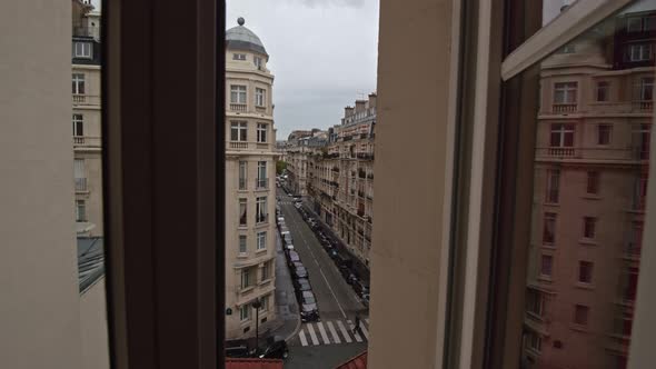 Timelapse of traffic in Parisian street, view through window, Stock Footage