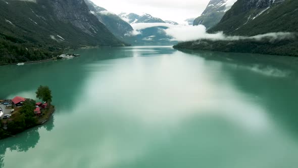 AERIAL: Flying over the beautiful turquoise lake Loen, western Norway ...