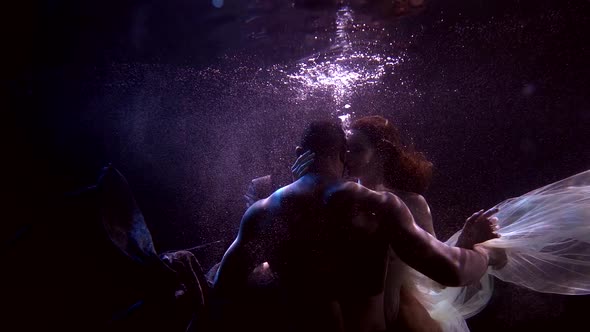 Woman And Man Are Holding Breath Underwater Floating And Caressing Each Other Stock Footage