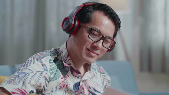 Close Up Of Asian Man Composer With Note Book And Looking At Paper ...
