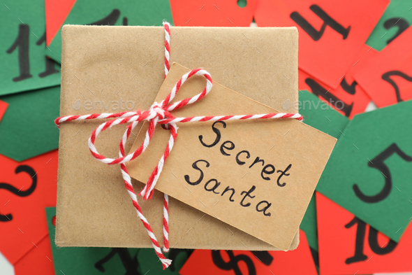 Secret Santa gift box, top view and closeup Stock Photo by AtlasComposer