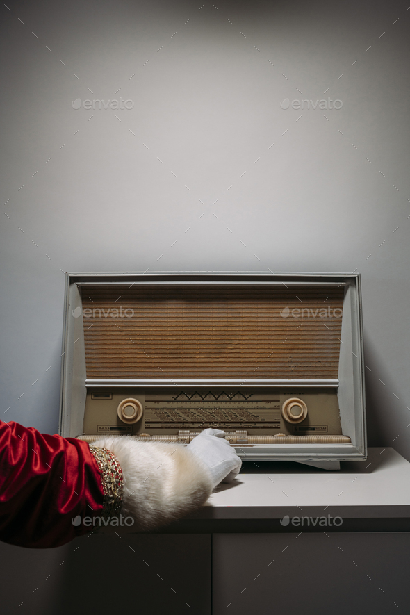 Hand of Santa Claus in glove and coat on vintage radio receiver Stock ...