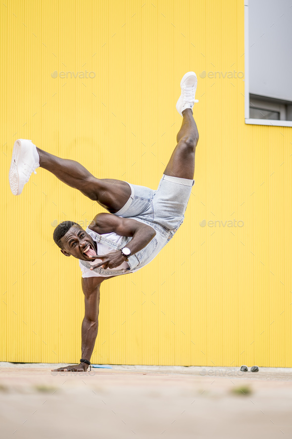 African man practicing break dance. Stock Photo by ADDICTIVE_STOCK