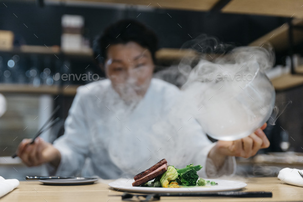 Chef cooking in restaurant with smoke dish Stock Photo by ADDICTIVE_STOCK