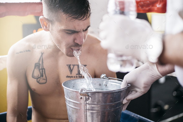 Boxer spitting to bucket Stock Photo by ADDICTIVE_STOCK | PhotoDune