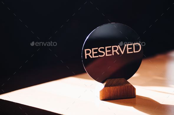 Restaurant reserved table for party. Reservation sign on wooden cafe ...