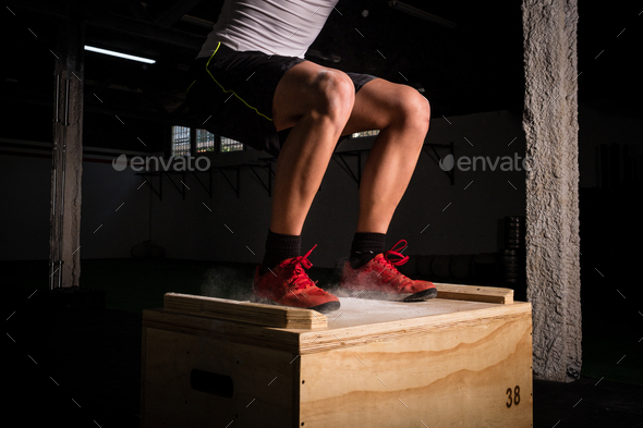 Man jumping on wooden box in gym Stock Photo by ADDICTIVE_STOCK | PhotoDune