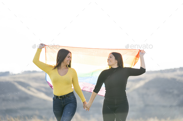 Young girl couple with gay flag Stock Photo by ADDICTIVE_STOCK | PhotoDune