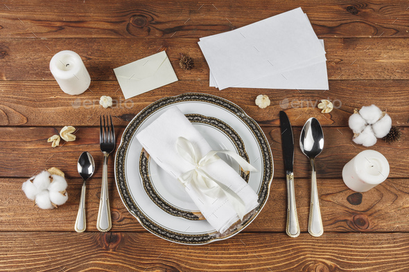 Beautiful table setting on wooden table from above Stock Photo by ...