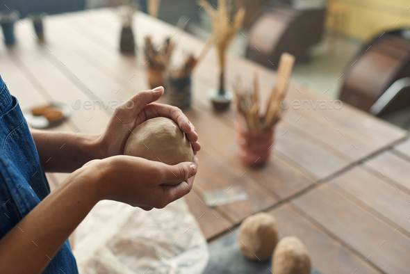 Hands Balling Up Clay Stock Photo by Pressmaster | PhotoDune