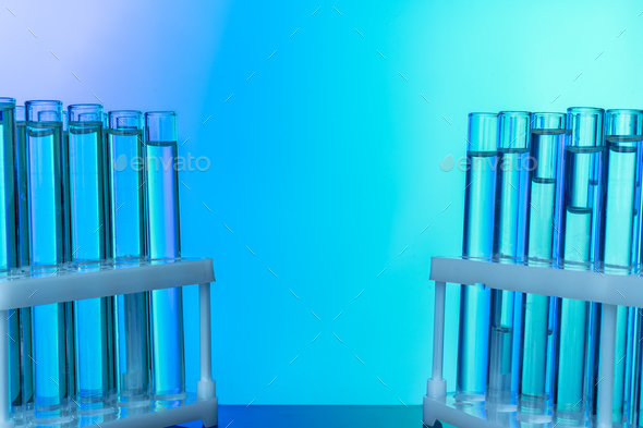 Row of test tubes with liquids on blue and green toned background Stock ...
