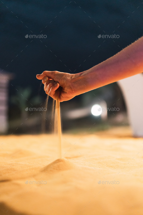 Crop hand spilling dry sand Stock Photo by ADDICTIVE_STOCK | PhotoDune