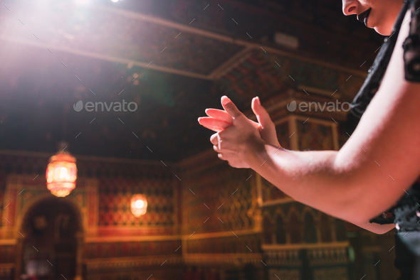 Woman clapping hands and dancing on scene Stock Photo by ADDICTIVE_STOCK
