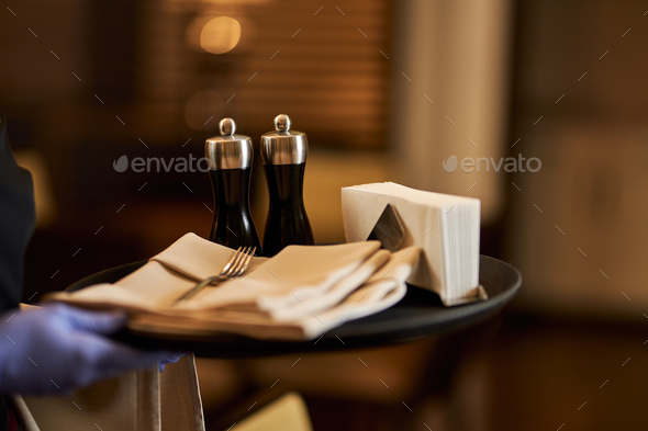 Waiter tray with napkins and essential table supplies Stock Photo by ...