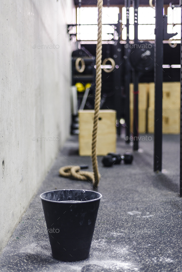 Rope near bucket of chalk in gym Stock Photo by ADDICTIVE_STOCK | PhotoDune