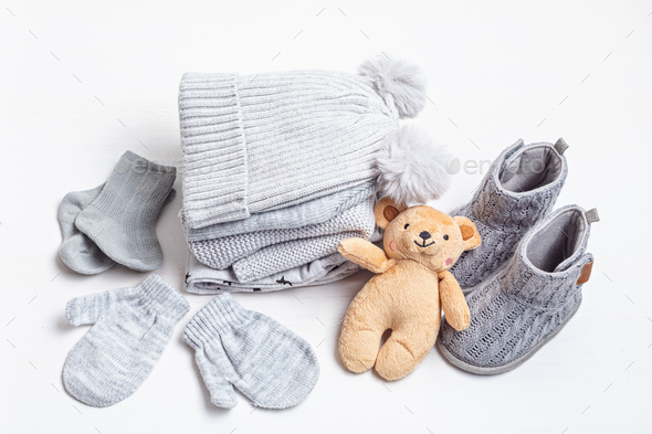 Collection of cute organic gender neutral baby clothes and booties ...