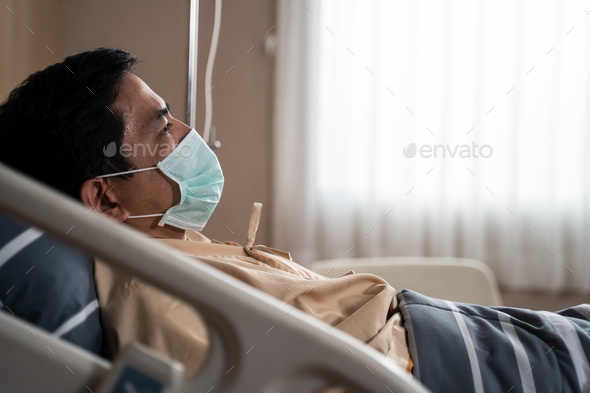Sickness Asian senior man have a recovery rest on bed after covid cure ...