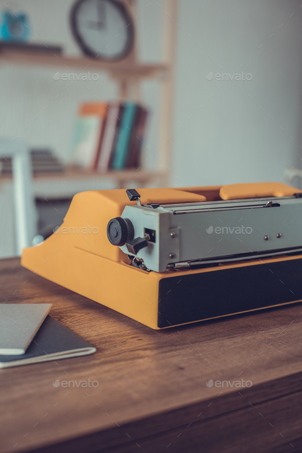 Vintage old typewriter at wooden desk table. Writer or screenwriter ...