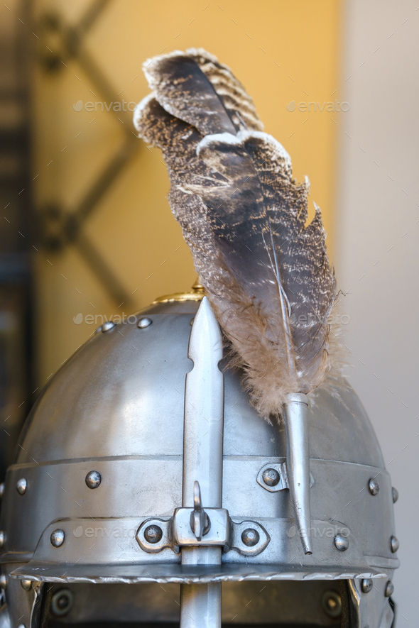 An ancient knight's helmet with a feather .Medieval concept Stock Photo ...