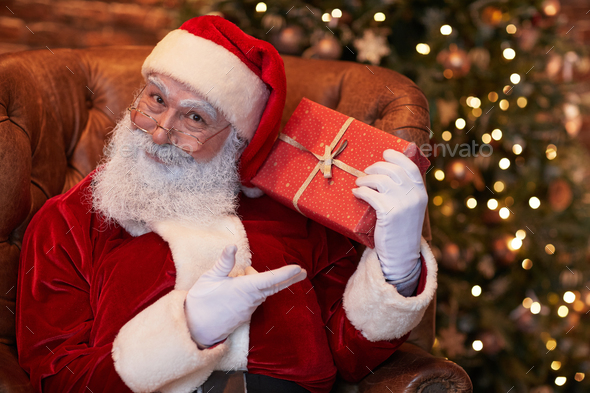 Santa Giving Gifts Stock Photo by seventyfourimages | PhotoDune