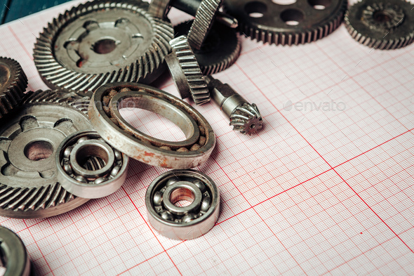 Car parts on graph paper close up. Engineering concept Stock Photo by ...