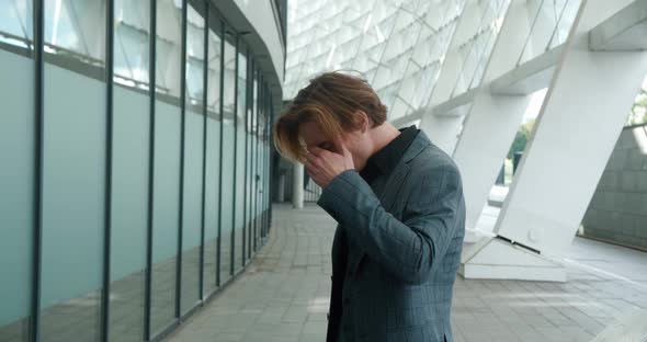 Angry Businessman Nervously Walks Near the Office Building, Stock Footage