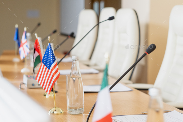 National Flags On Conference Table Stock Photo by Pressmaster | PhotoDune